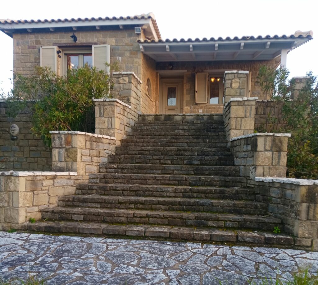 Greek stone house with sea view on bay of Finikounda